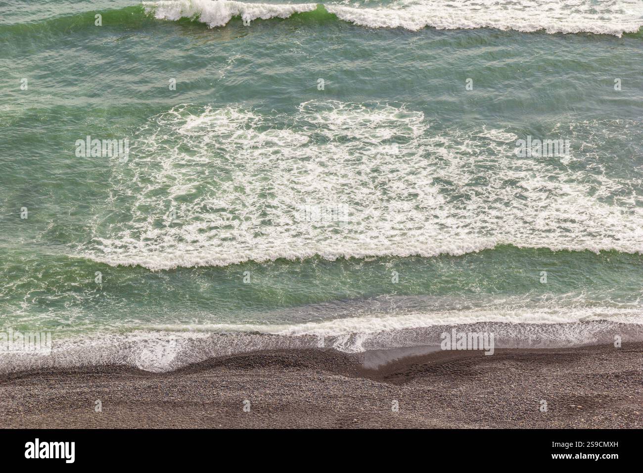 Waves on pebble beach - Miraflores, Lima, Peru Stock Photo - Alamy