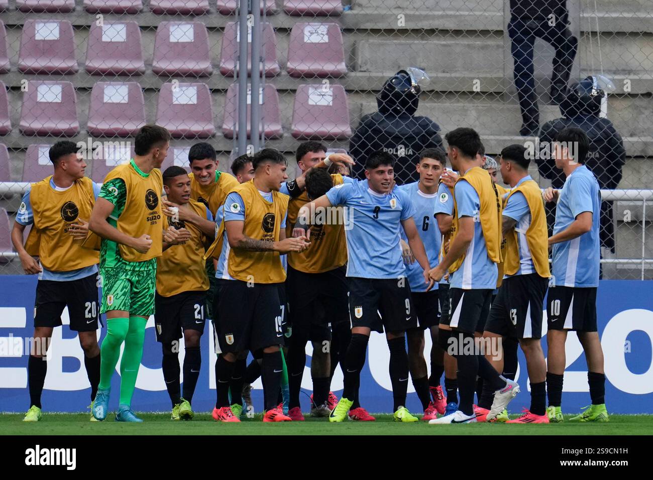 Uruguay's Renzo Machado (9) celebrates with teammates after scoring his ...