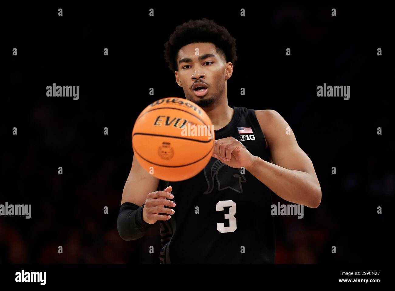 Michigan State guard Jaden Akins (3) passes the ball during the second ...