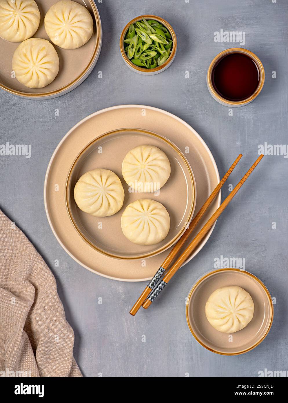 Food photography of steamed duck bao buns, spring onion, soy sauce ...