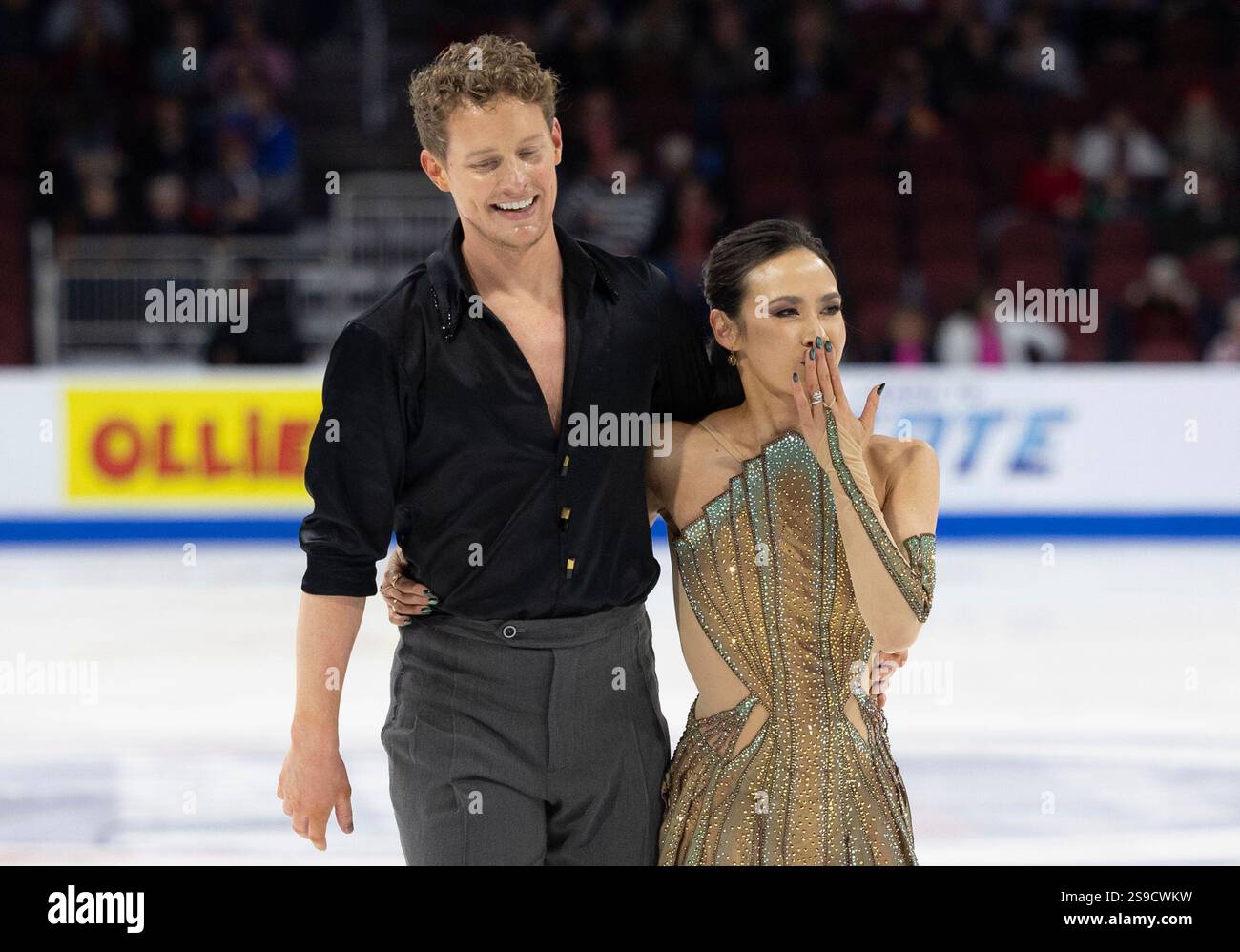 Madison Chock, right, and Evan Bates, left, come off the ice after ...