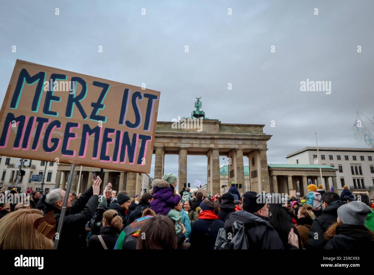 Berlin, Germany Anti-AfD protest: Protester holds sign reading "Merz ...