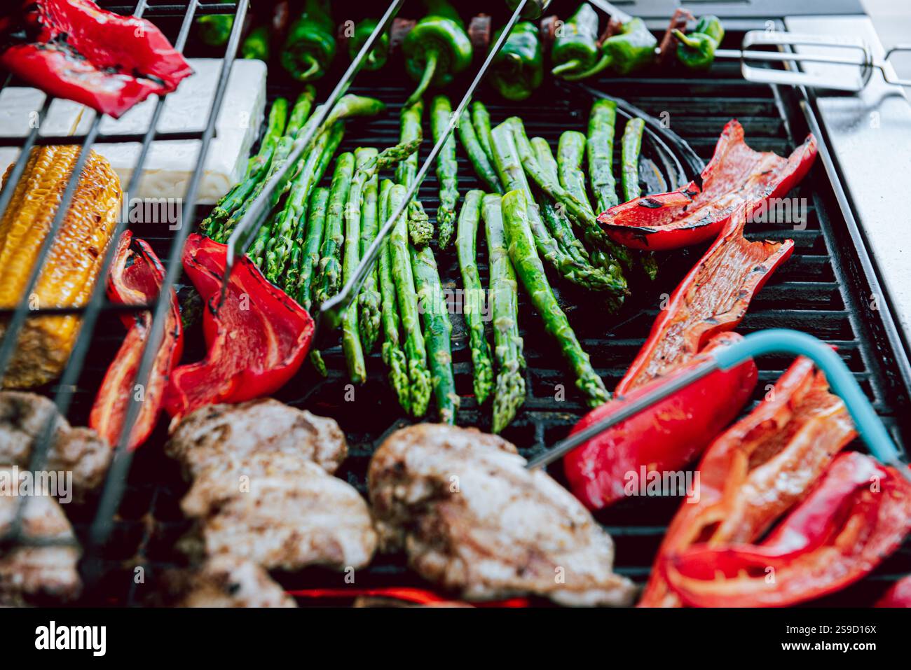 Cooking of meat and vegetables on a grill or on barbeque with ...