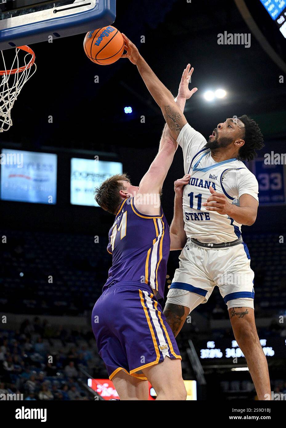 Indiana State's Aaron Gray tries to score over Northern Iowa's Jacob ...
