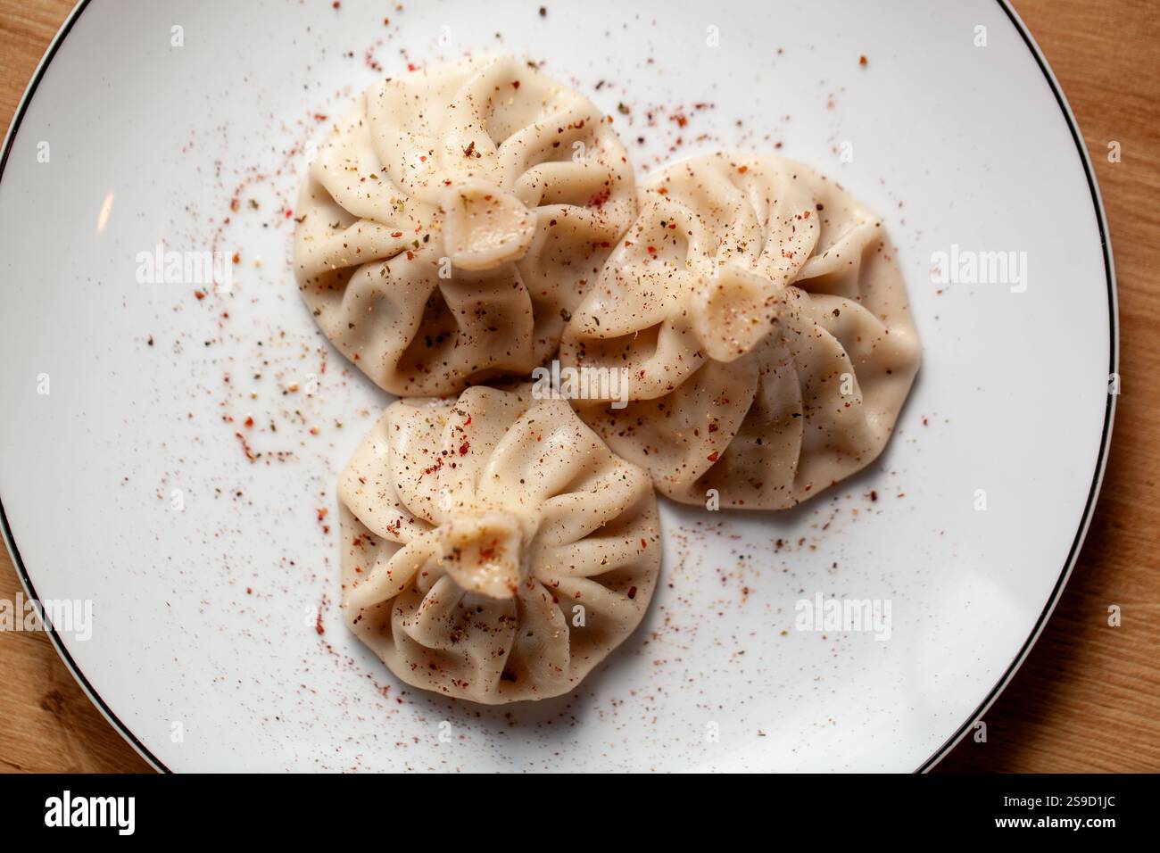 Traditional georgian khinkali cooked in hi-res stock photography and ...