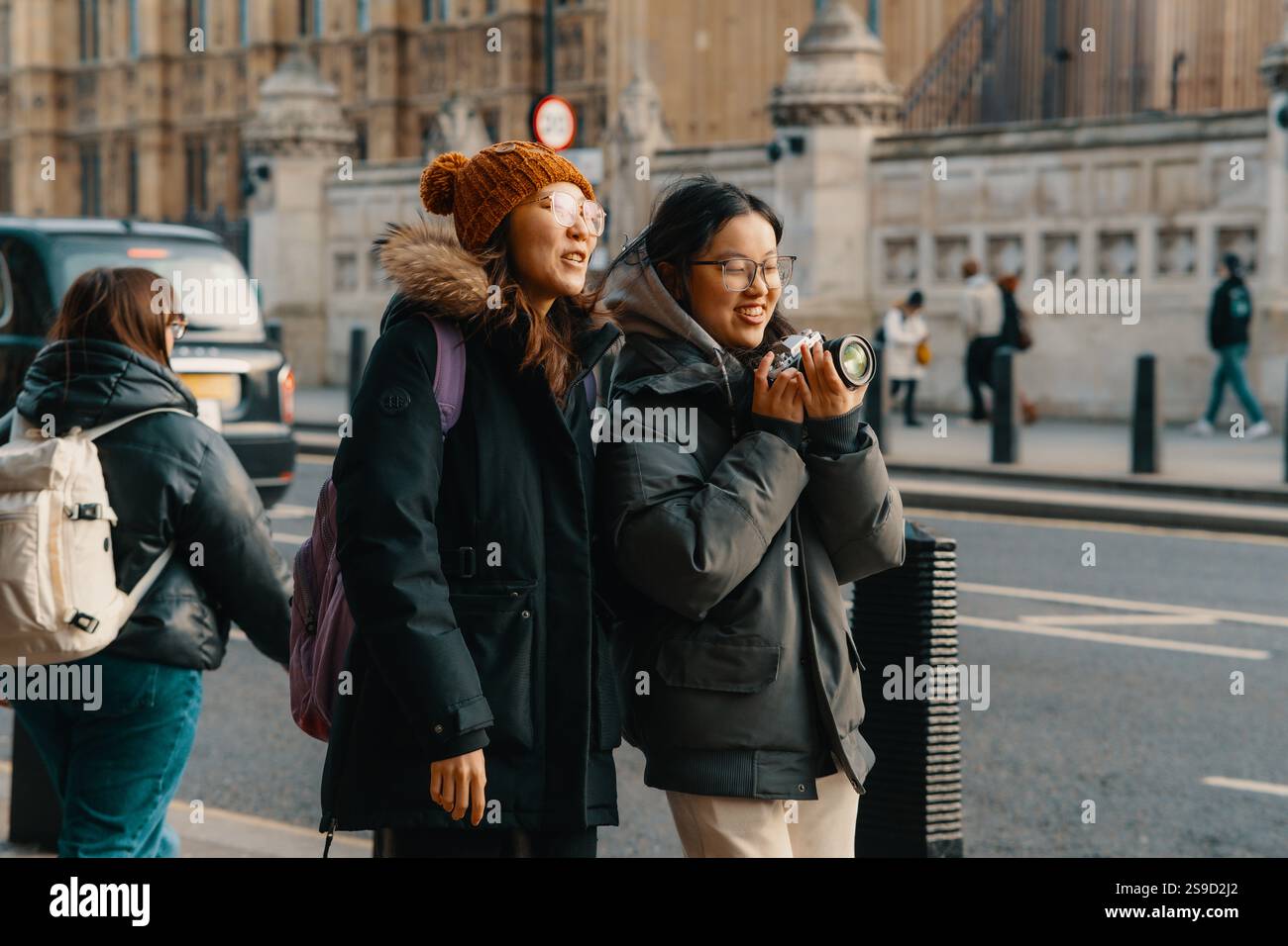 Two Friends Exploring the City Streets While Taking Photographs ...