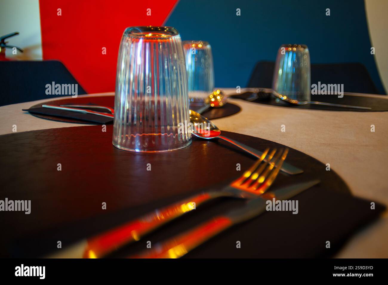 Upside down glass on restaurant table Stock Photo - Alamy
