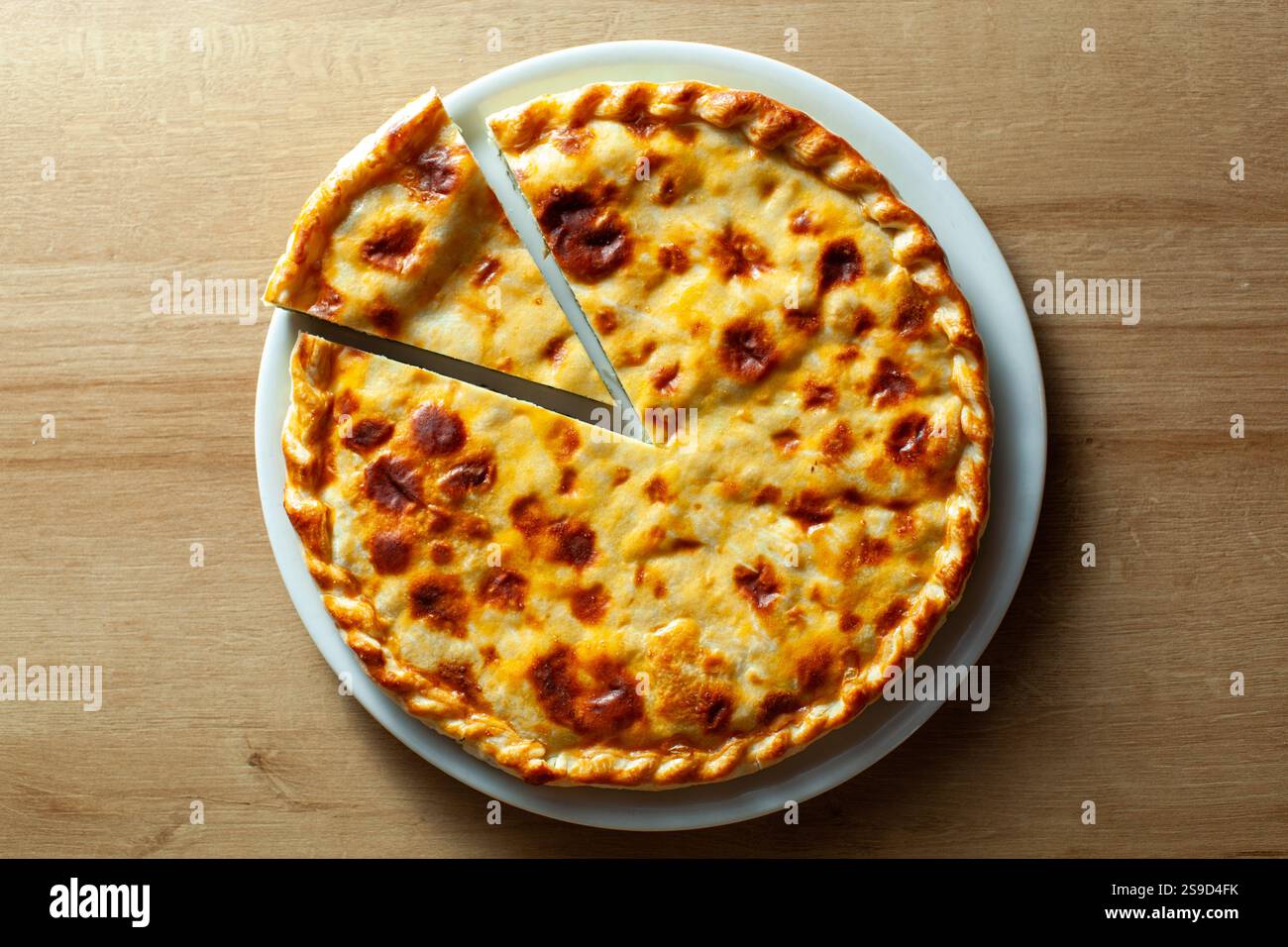 Traditional Russian pie with golden crust Stock Photo - Alamy