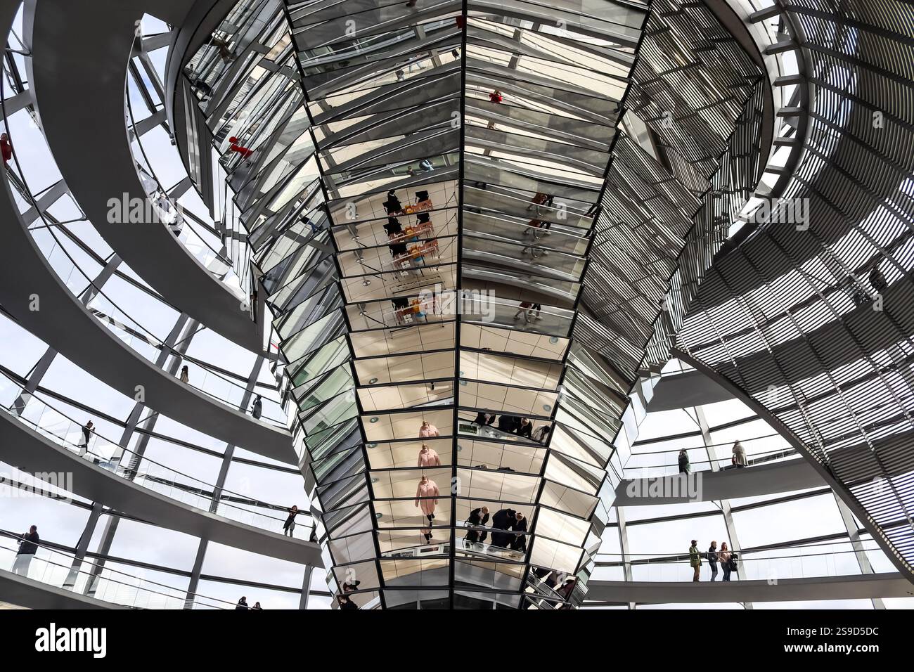 Berlin, Germany - 03. October 2024: Upward view of mirrored cone inside Reichstag dome in Berlin ...