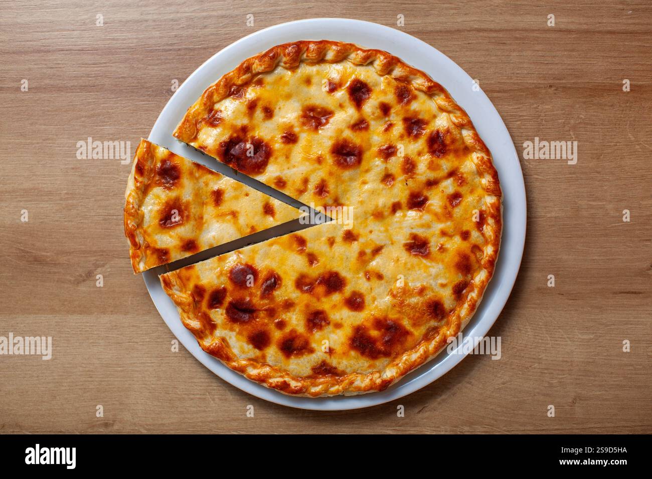Traditional Russian cheese pie with slices Stock Photo - Alamy
