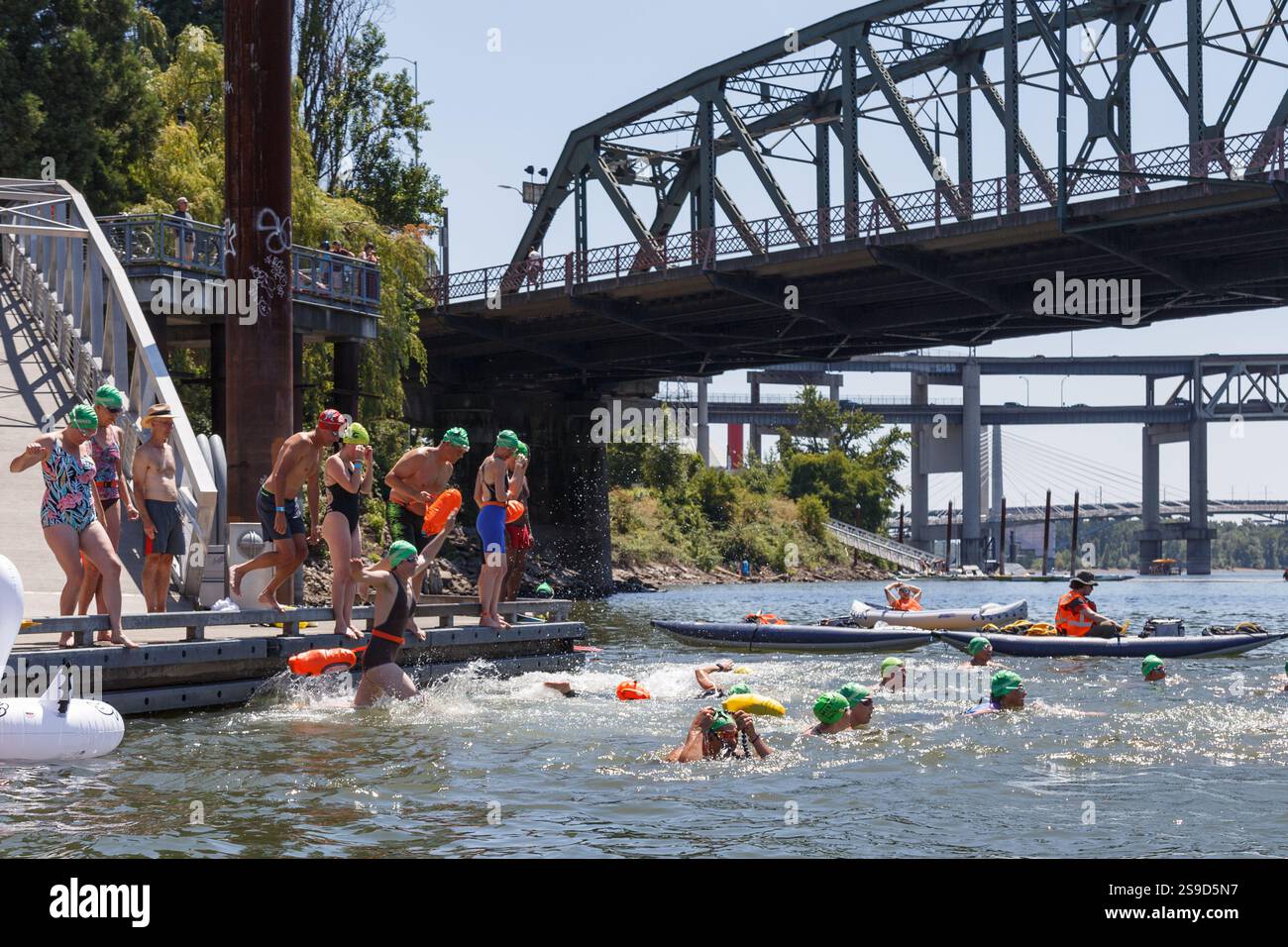 The River Huggers swim across the Willamette River for the The Float 7 ...