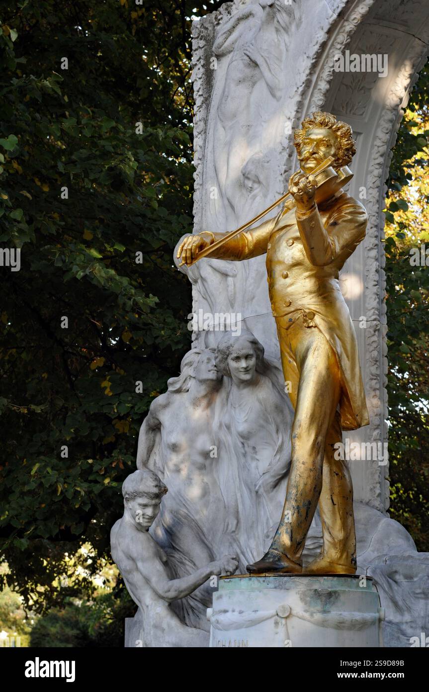 The gilded statue of composer Johann Strauss II at his monument in ...
