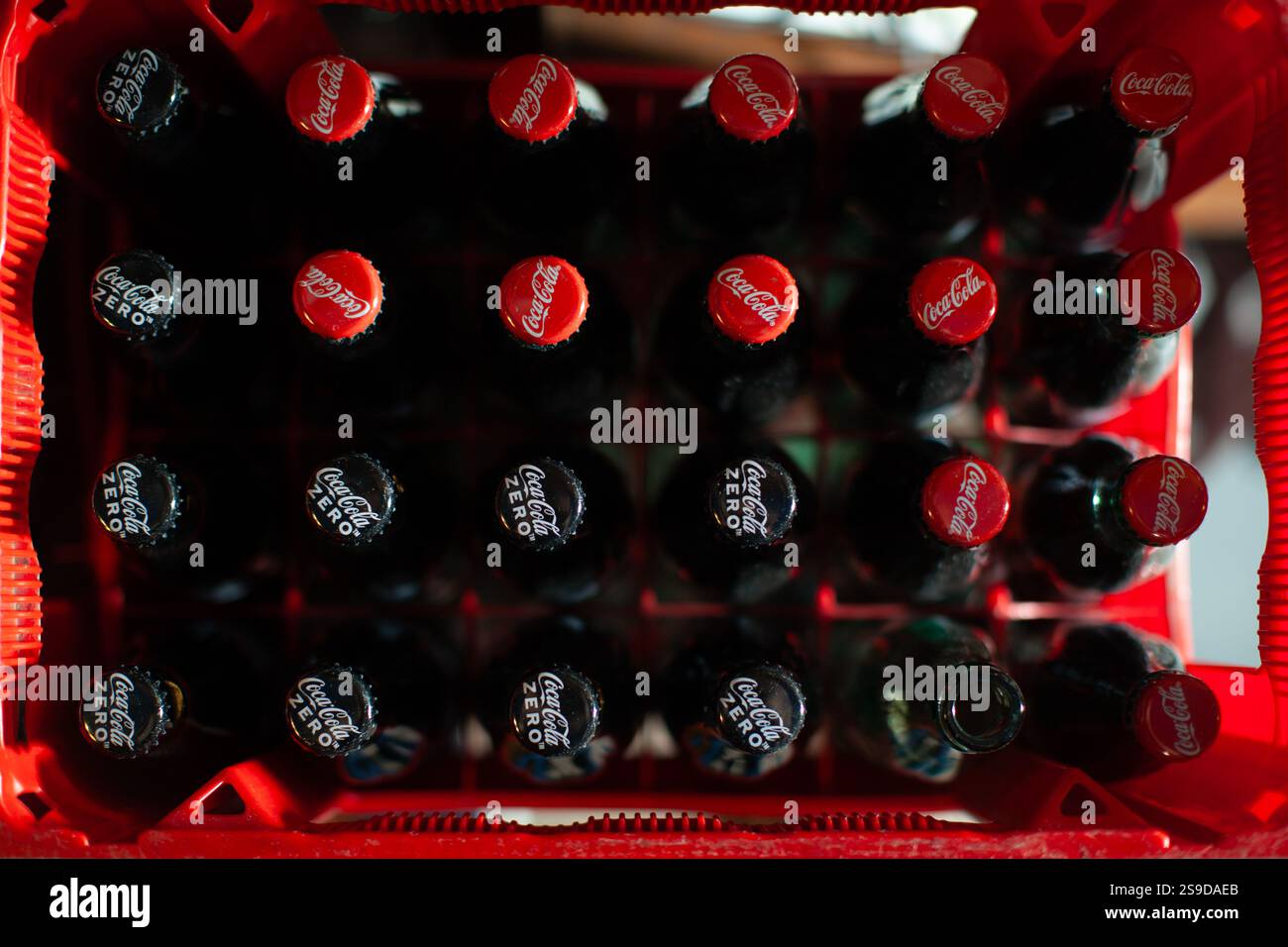 Coca Cola bottles in red crate from above Stock Photo - Alamy
