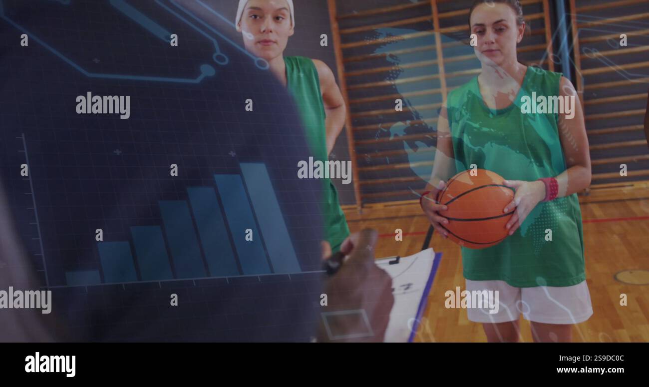 Basketball players listening to coach with data analysis image over gym ...