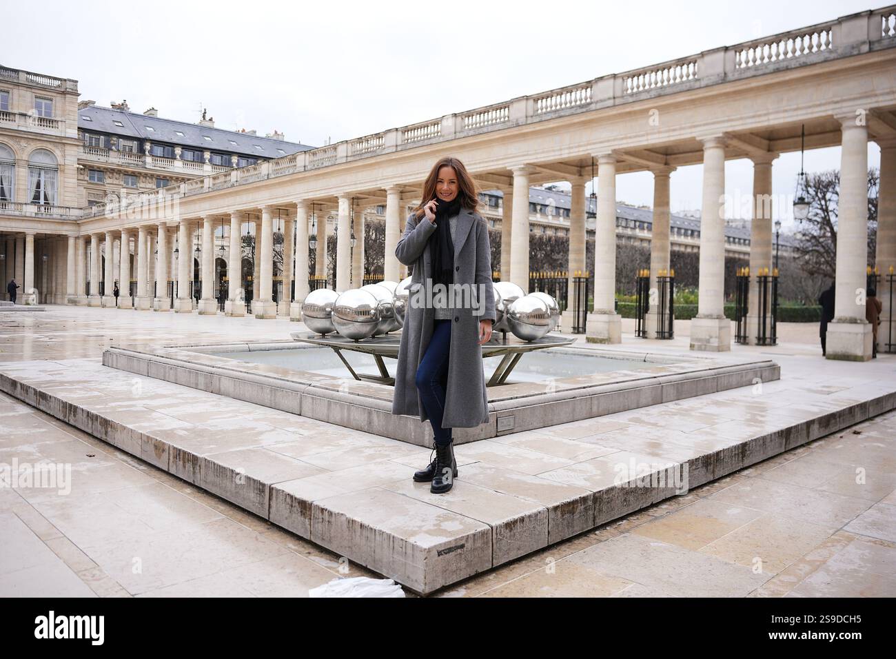 Elegant Woman Posing at Palais Royal Courtyard in Paris Stock Photo - Alamy