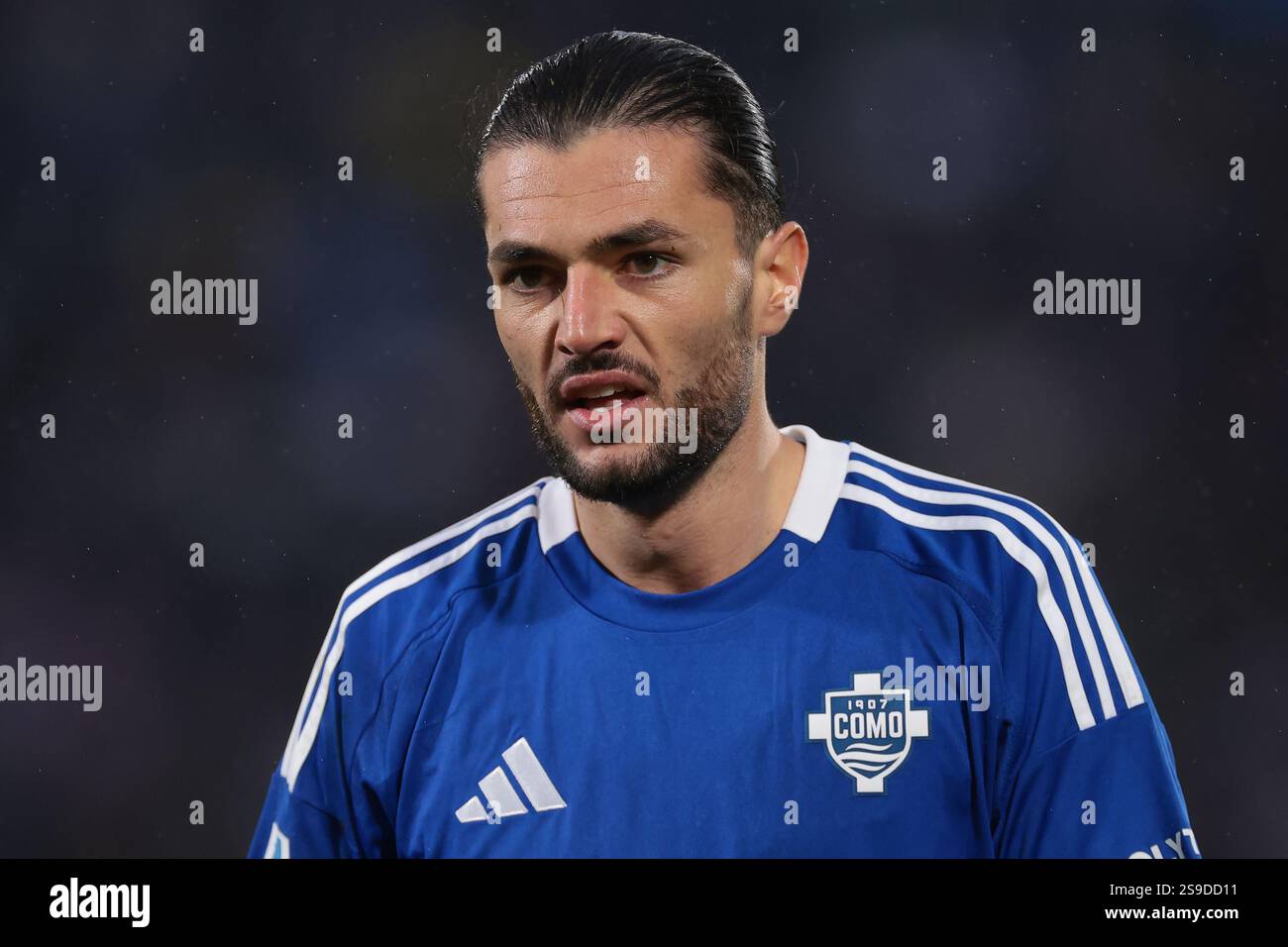 Como, Italy, 25th January 2025. Alberto Dossena of Como 1907 reacts as ...