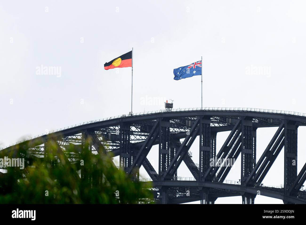 Both Aboriginal and Australian flags fly on the Sydney Harbour Bridge ...