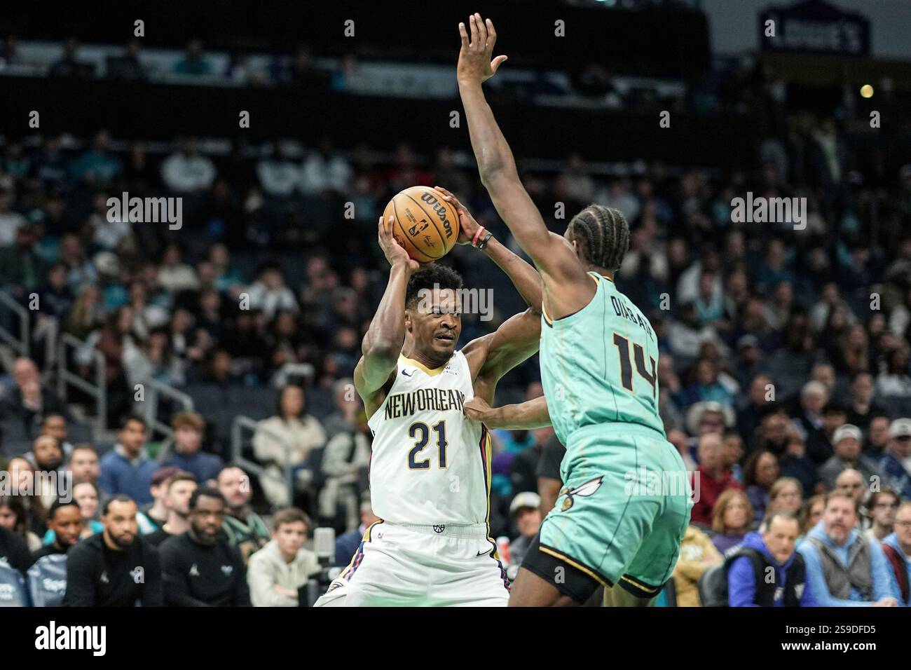 New Orleans Pelicans center Yves Missi (21) is defended by Charlotte ...