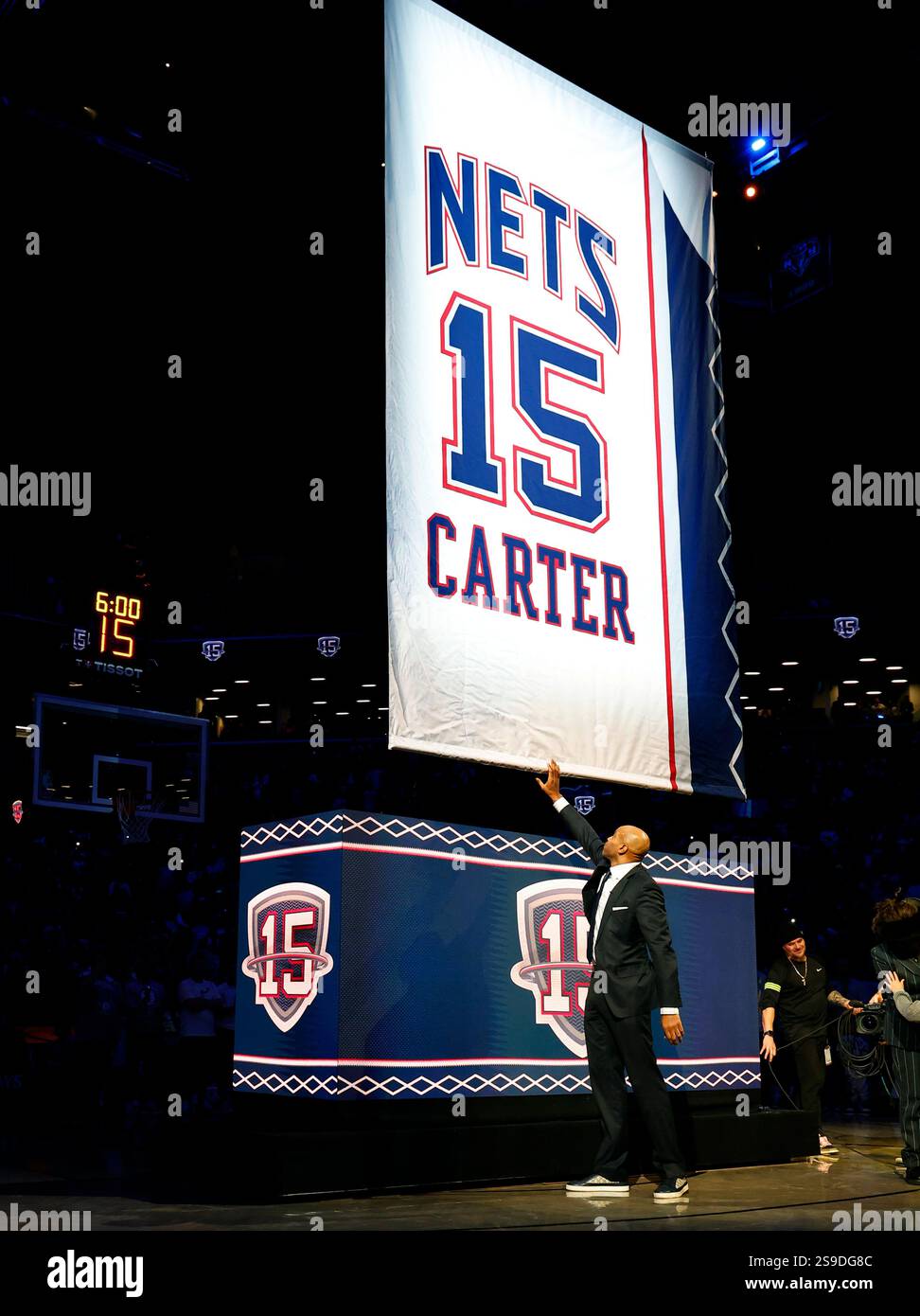 Vince Carter touches his number during a jersey retirement ceremony at ...