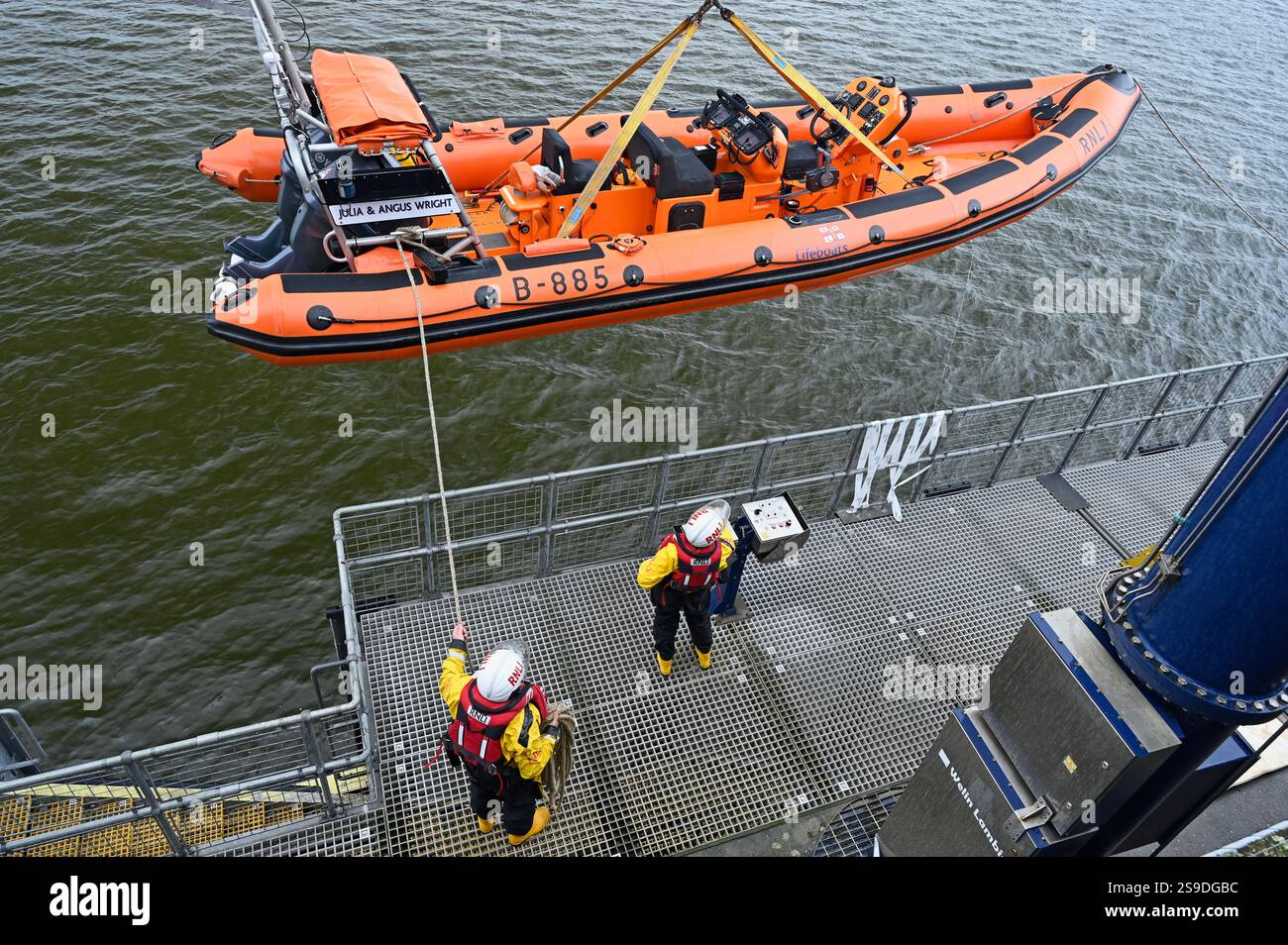Two RNLI personnel at the pier head control centre. The lifeboat, Julia ...