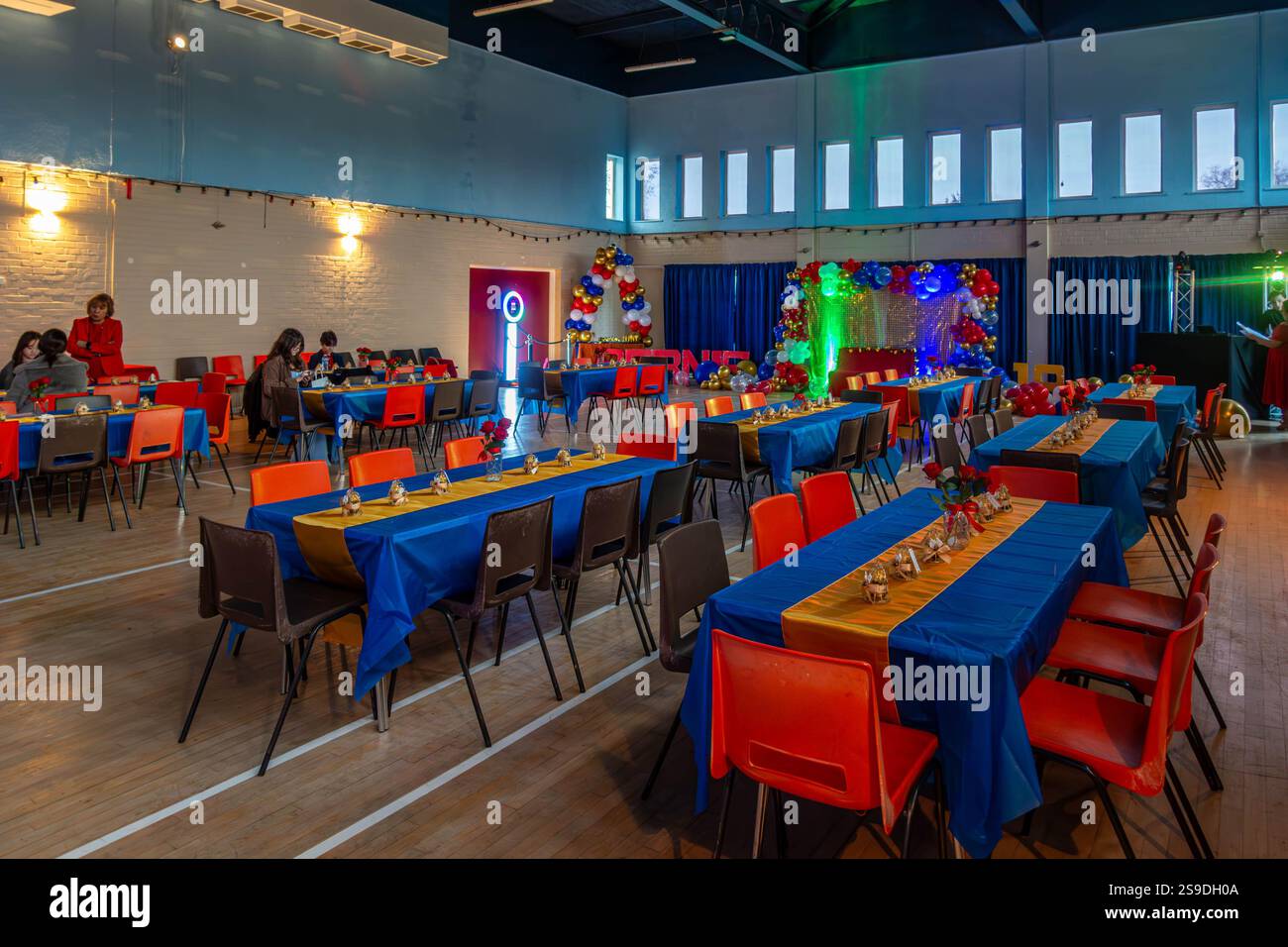 A sports hall set up with table, chairs and decorations ready for a ...