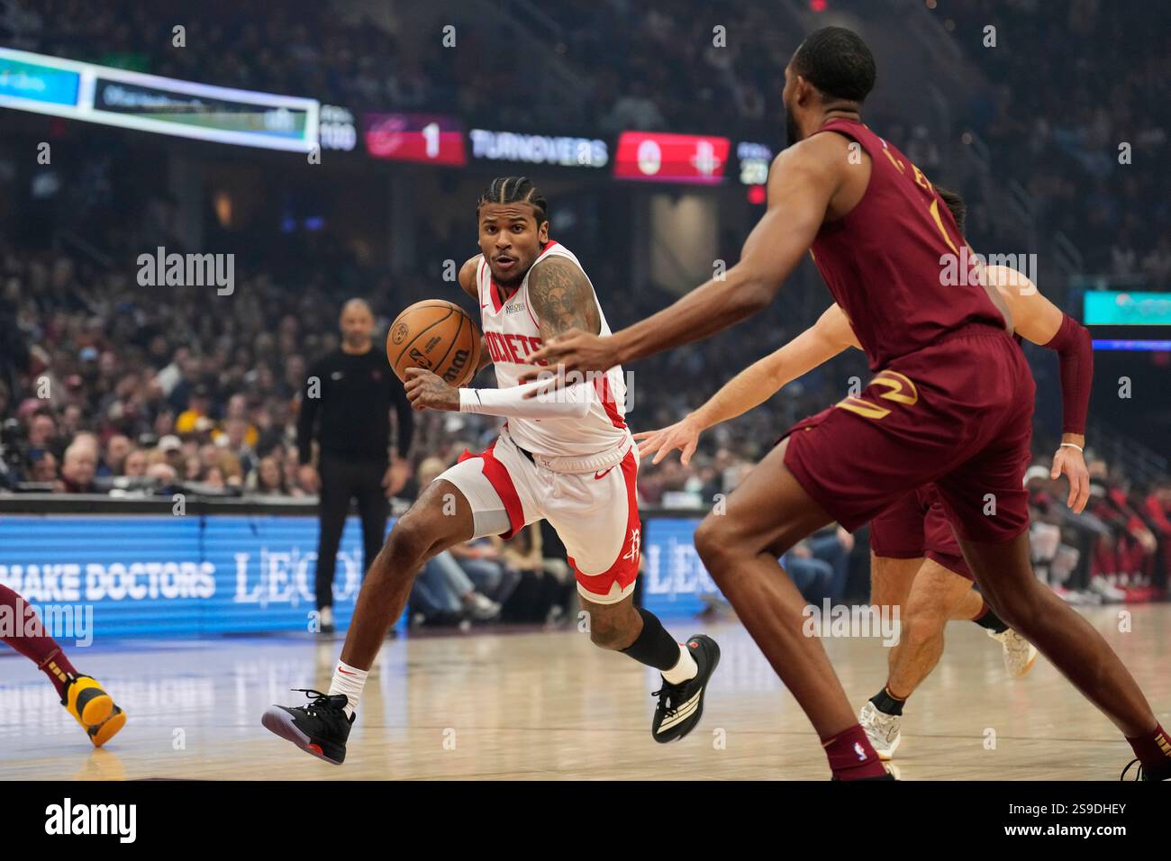 Houston Rockets guard Jalen Green, left, drives past Cleveland ...