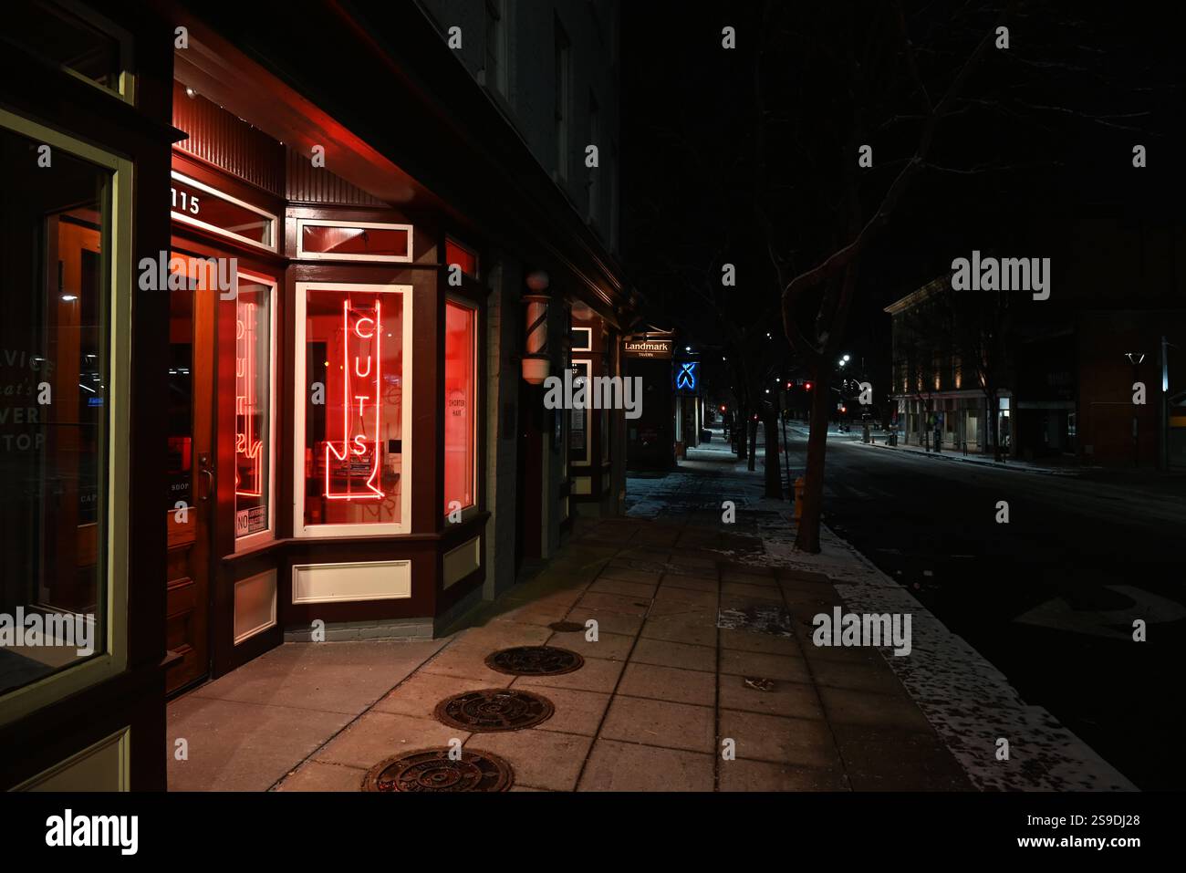Sidewalk after dark in part of the historic business district of ...