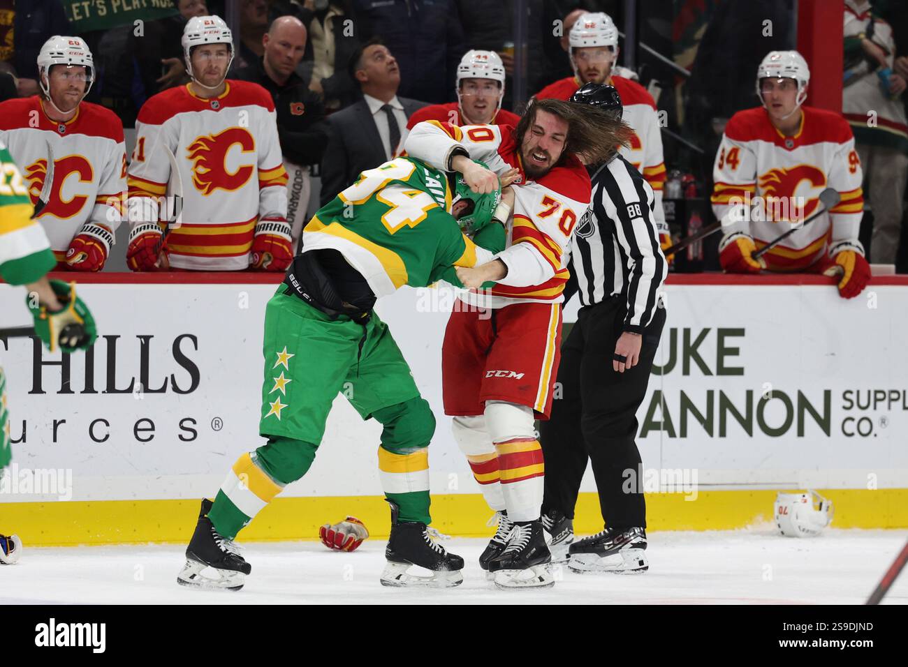 Calgary Flames left wing Ryan Lomberg (70) punches Minnesota Wild ...
