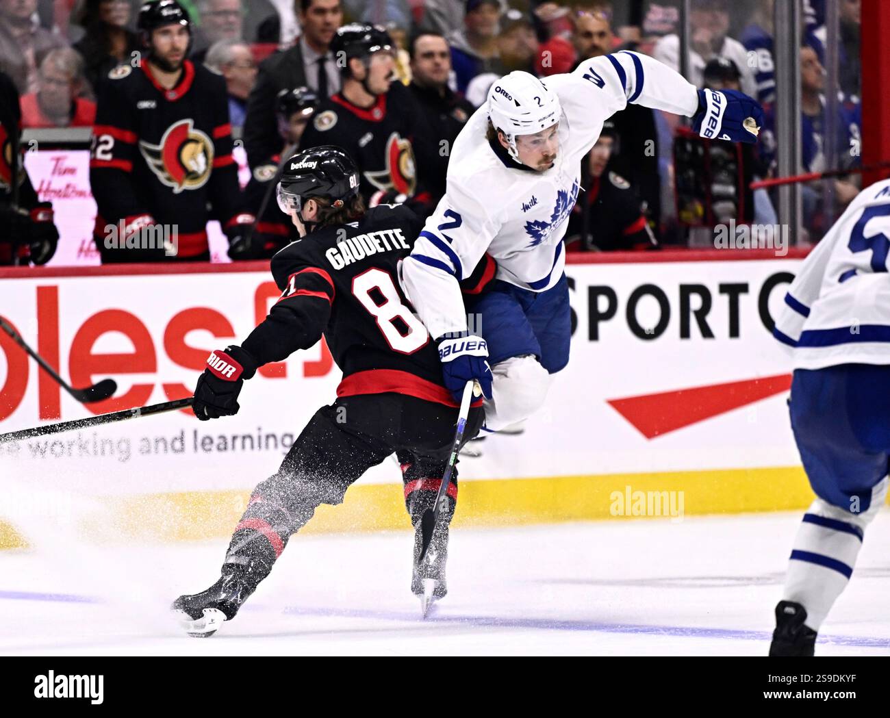 Toronto Maple Leafs' Simon Benoit (2) flies through the air as he ...