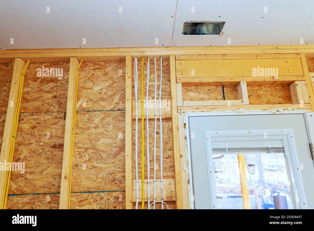 Installing wood framing, electrical wiring in residential construction ...