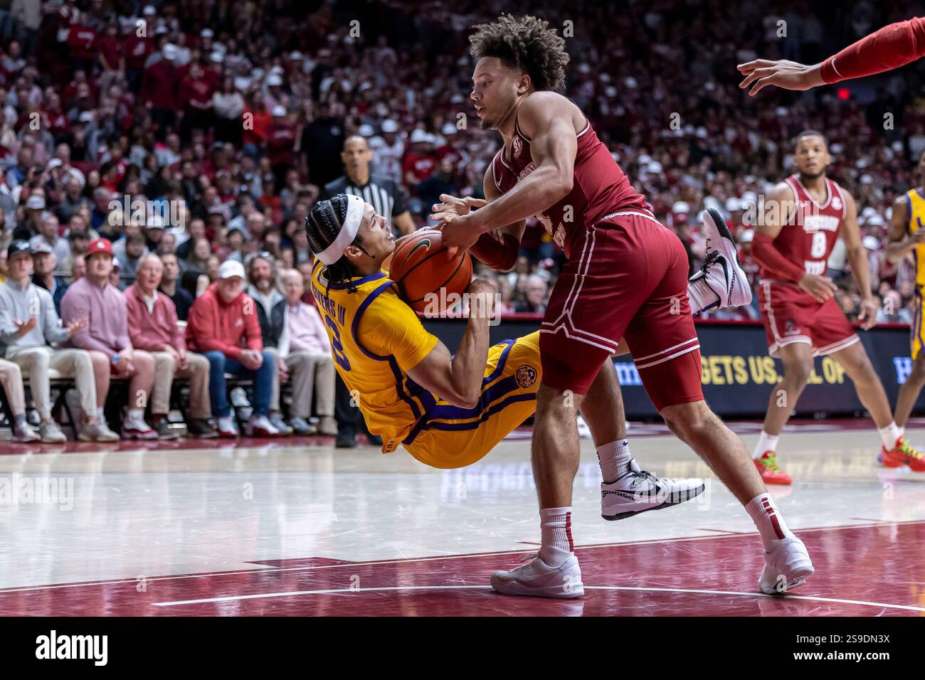 LSU guard Curtis Givens III, left, and Alabama guard Mark Sears battle ...