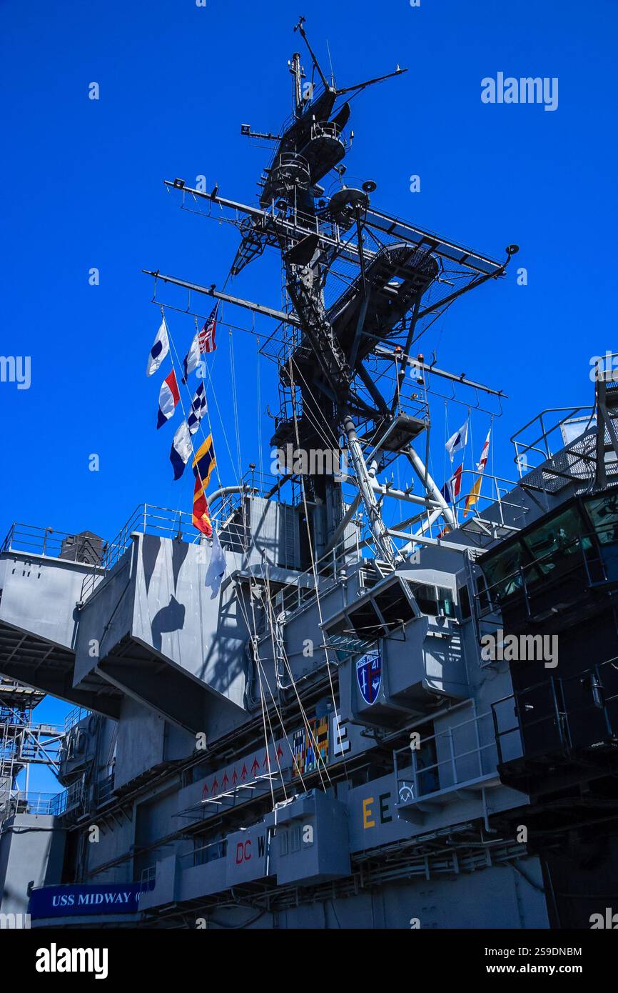 A large ship with flags on the mast. The flags are of different colors ...