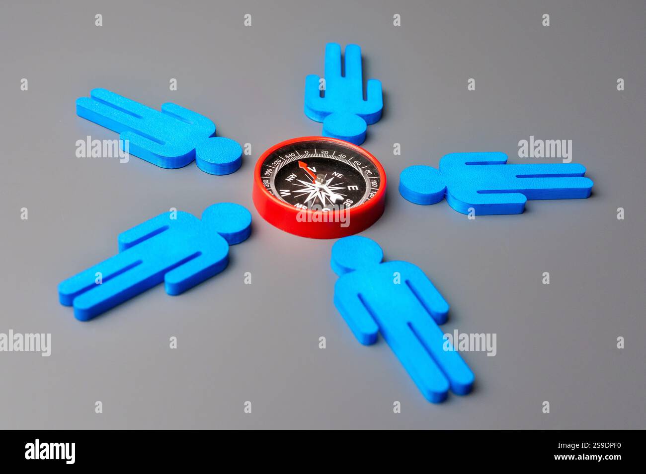 A compass surrounded by blue figures, symbolizing leadership, guidance ...