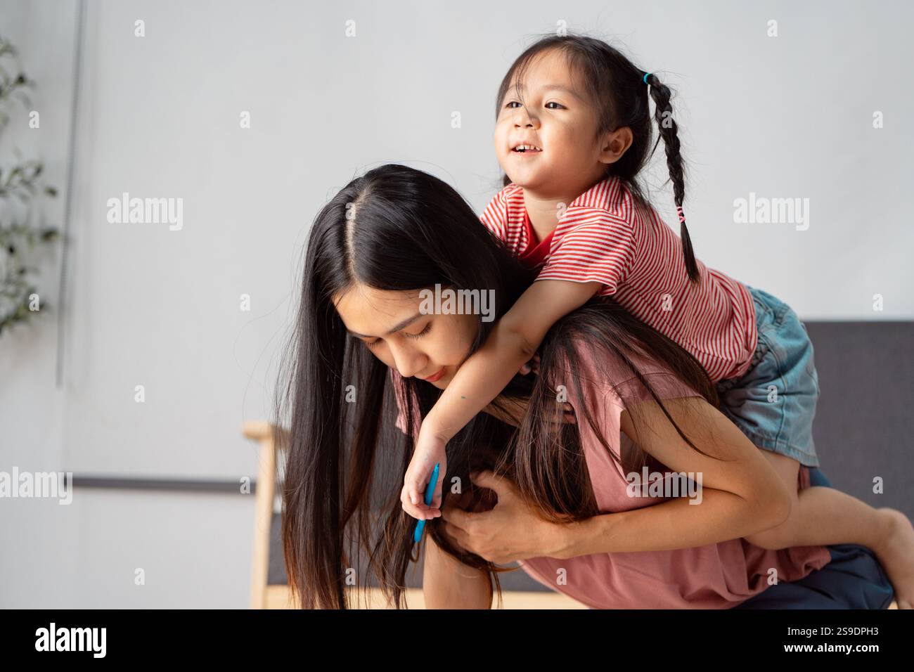 Playful learning moments with a mother and child sharing joy and ...