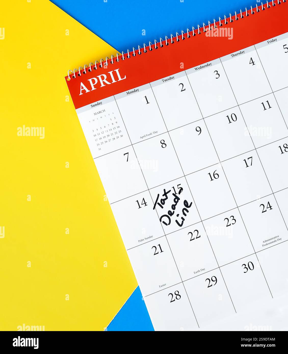 A close-up view of a calendar set to April, showing a tax deadline ...