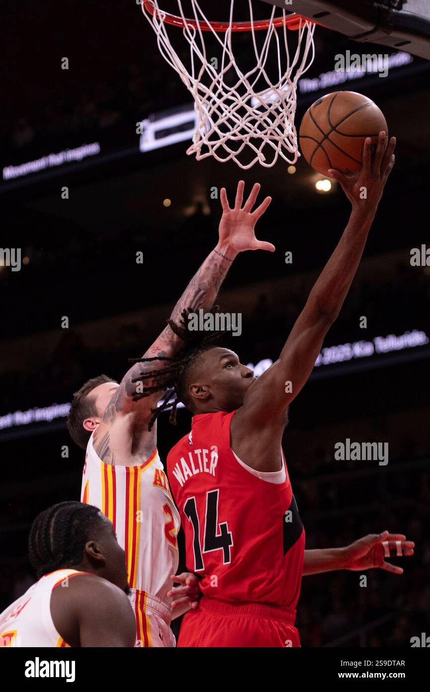 Toronto Raptors guard Ja'Kobe Walter (14) shoots past Atlanta Hawks ...