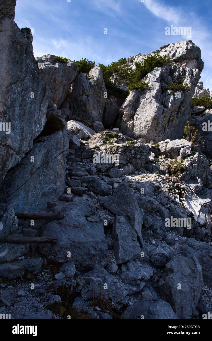Rock and wood steps on a path through rocks on a sunny spring day at ...