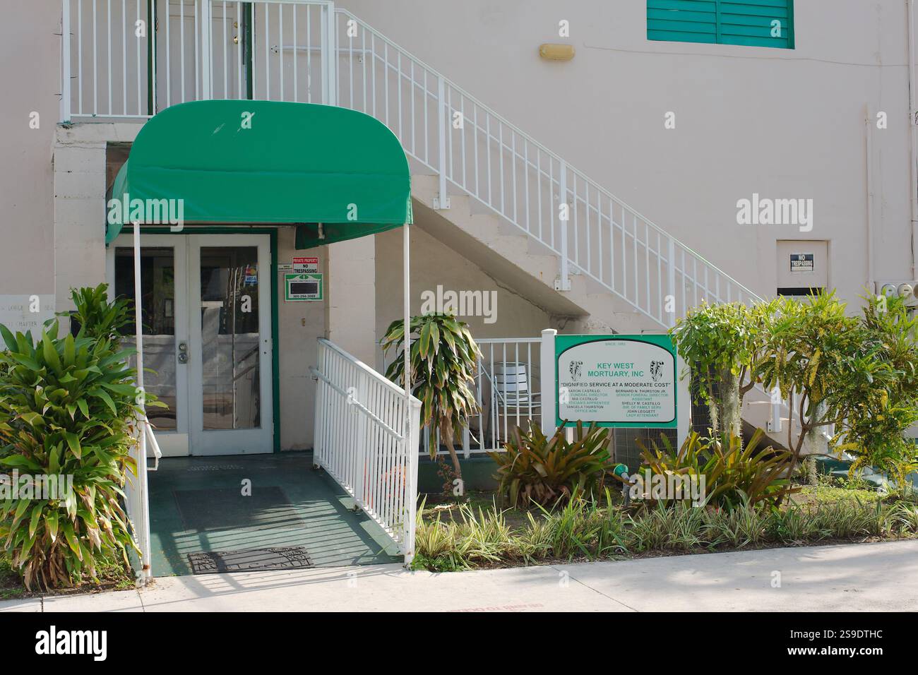 Key West Mortuary Funeral Home side view of entrance with green canopy ...