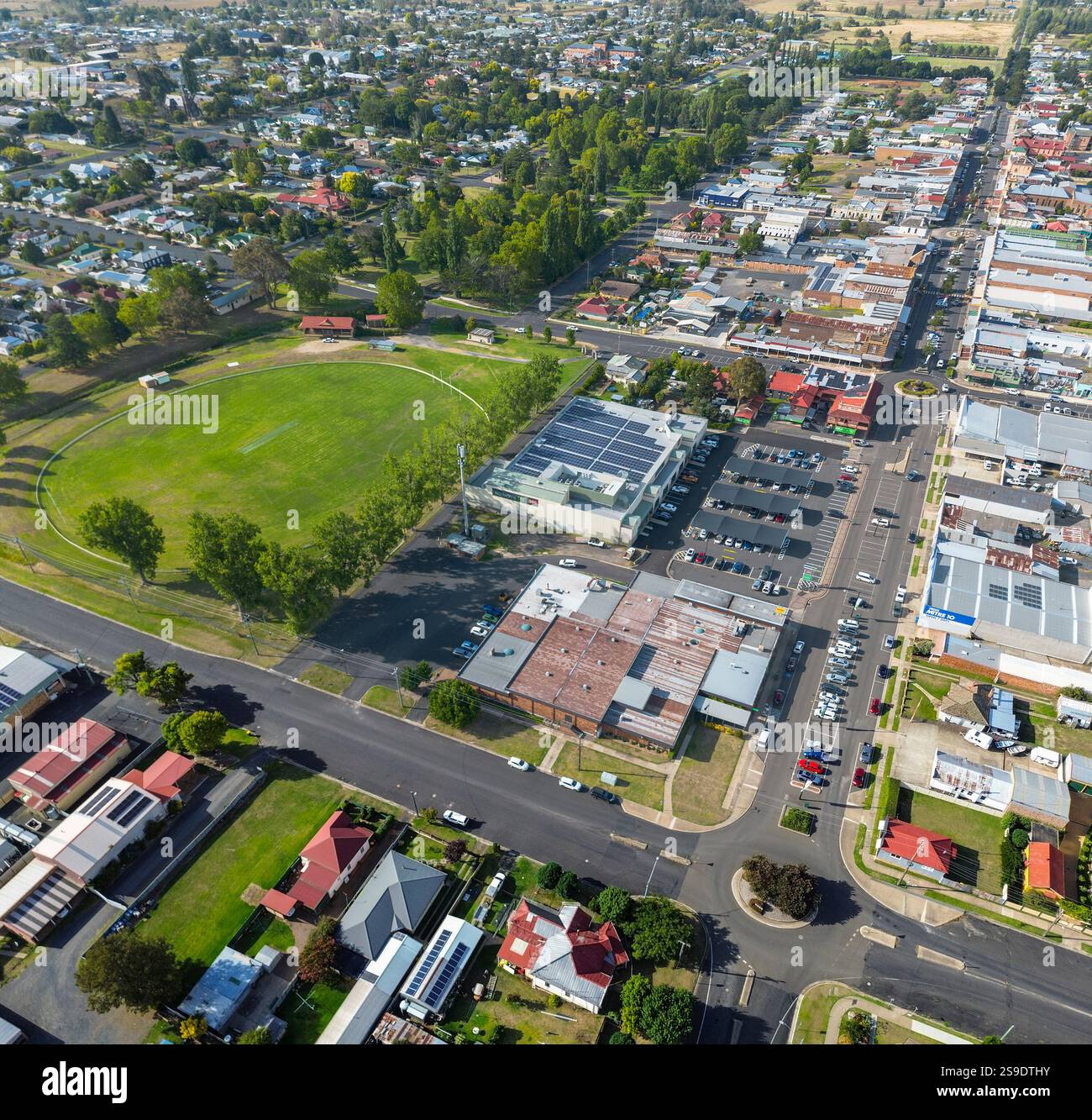 Aerial view showing the cricket pitch, Woolworths and the RSL in the foregrounda at Glen Innes ...