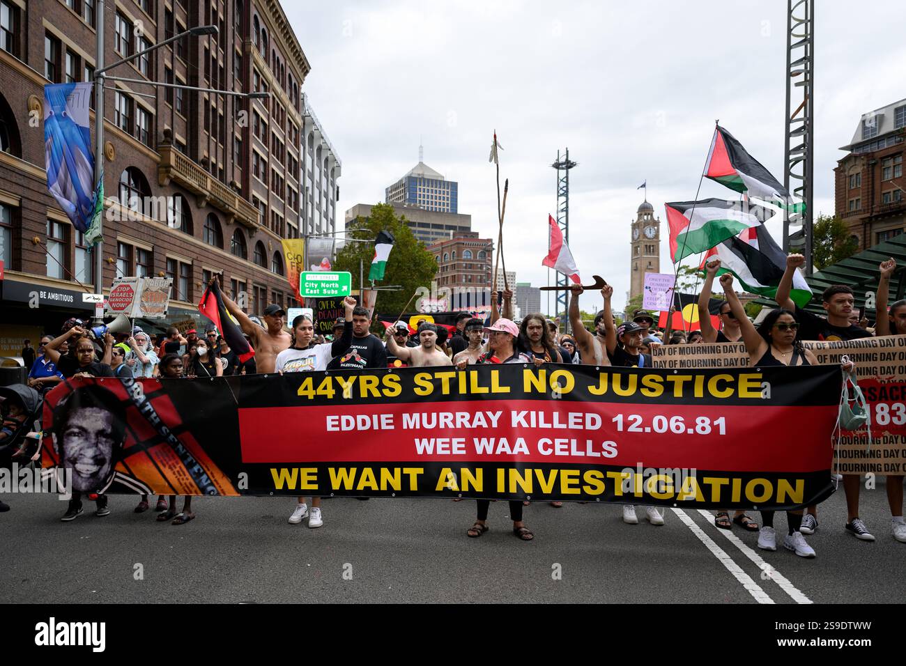 Participants walk holding up a no justice sign during an Invasion Day ...