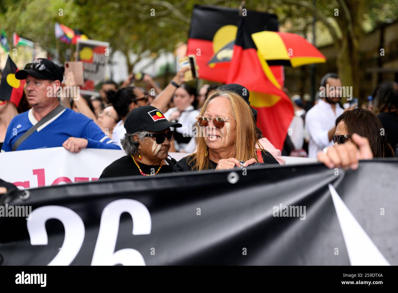 Participants walk during an Invasion Day rally in Sydney, Sunday ...