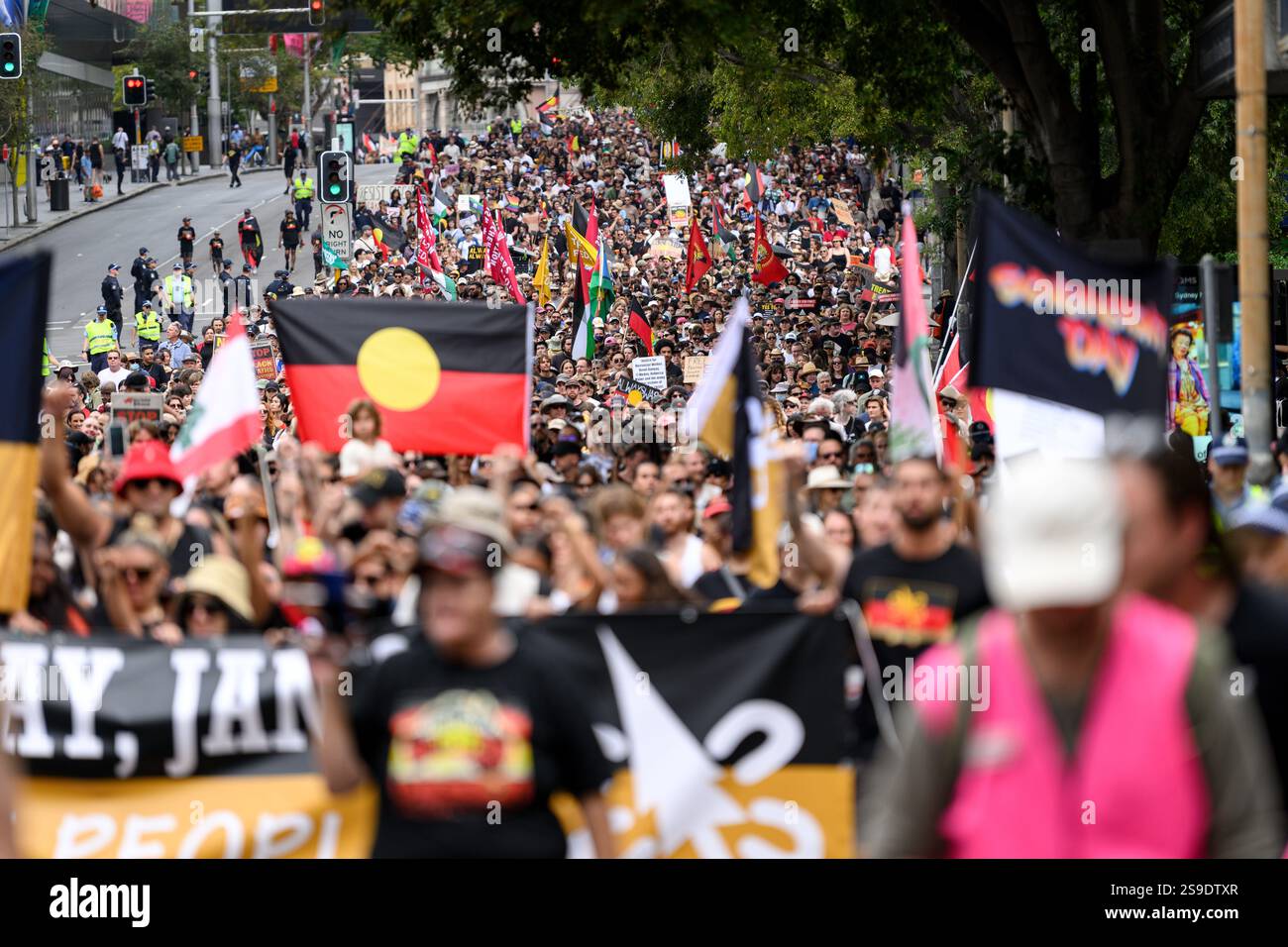 Participants walk during an Invasion Day rally in Sydney, Sunday ...