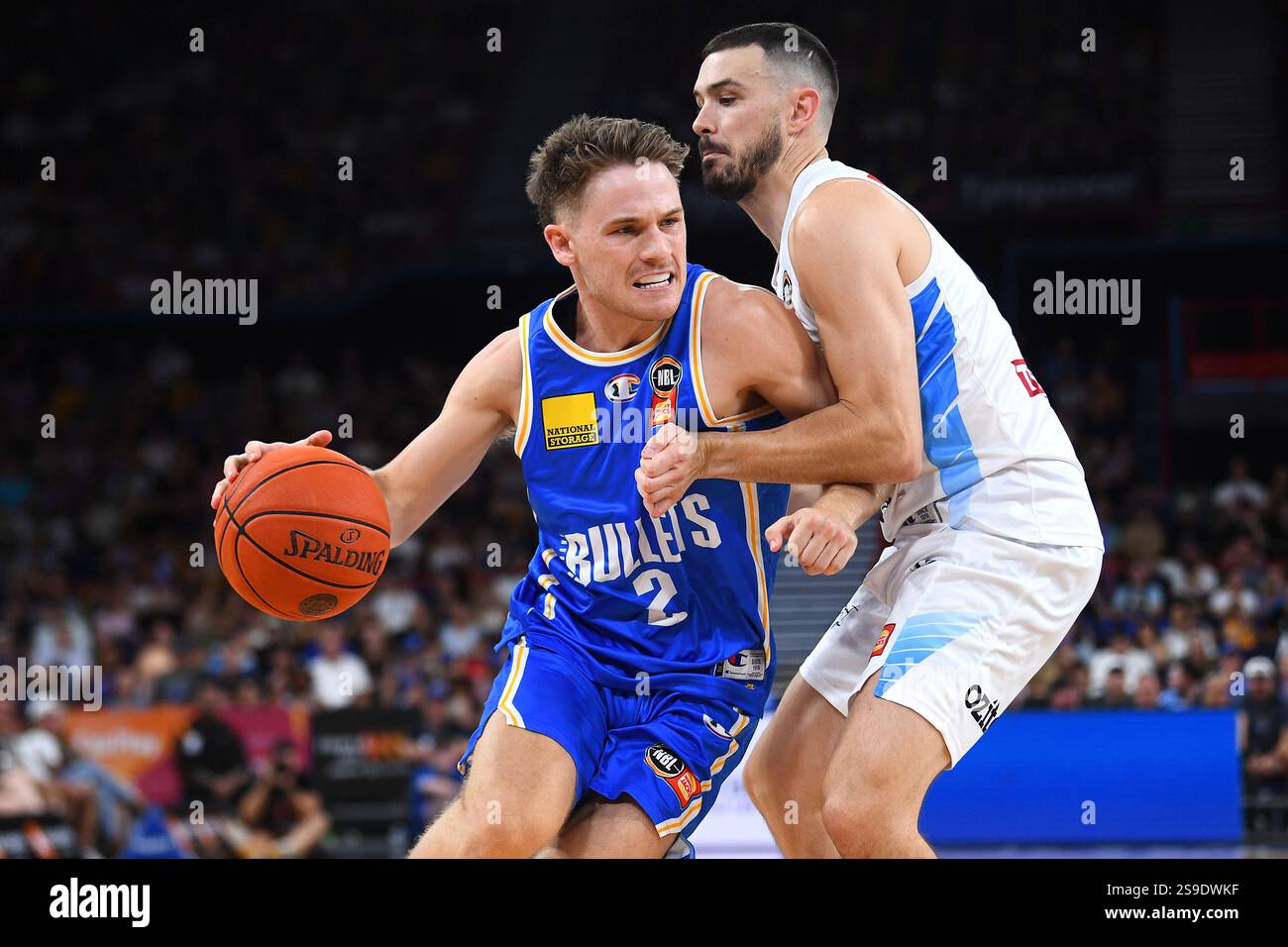 Isaac White of the Bullets is guarded by Chris Goulding of Melbourne ...