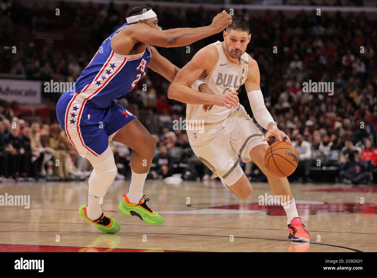 Chicago Bulls center Nikola Vucevic, right, drives to the basket ...