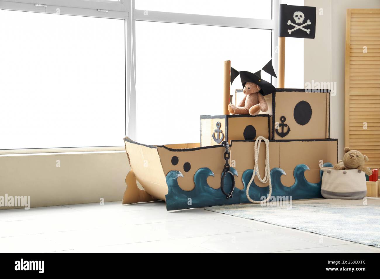 Pirate cardboard ship near window in children's room Stock Photo - Alamy