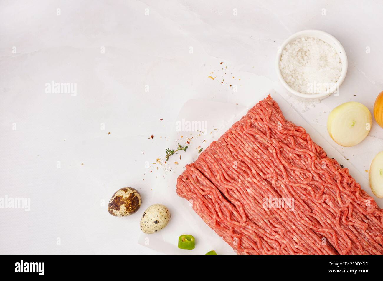 Fresh minced meat with spices on white background Stock Photo - Alamy