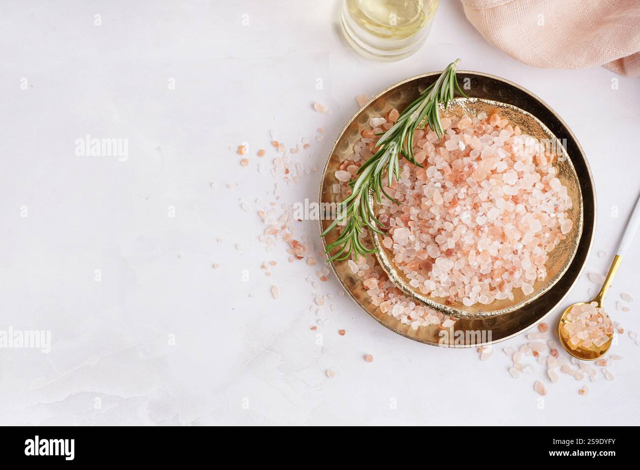 Plates with Himalayan pink salt and rosemary on white background Stock ...