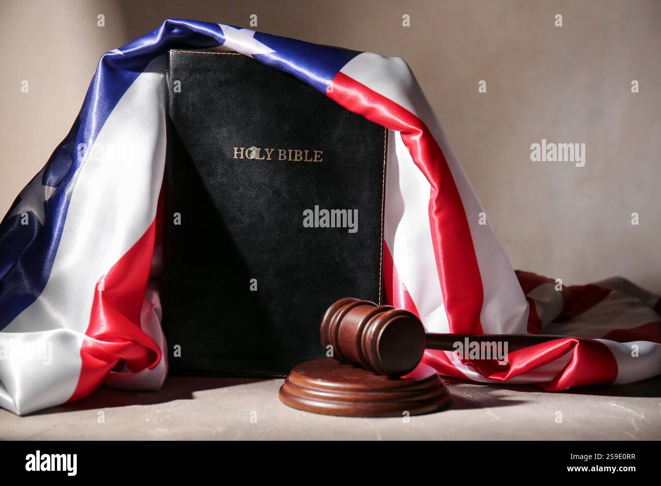 Holy Bible with flag of USA and judge's gavel on grunge background ...