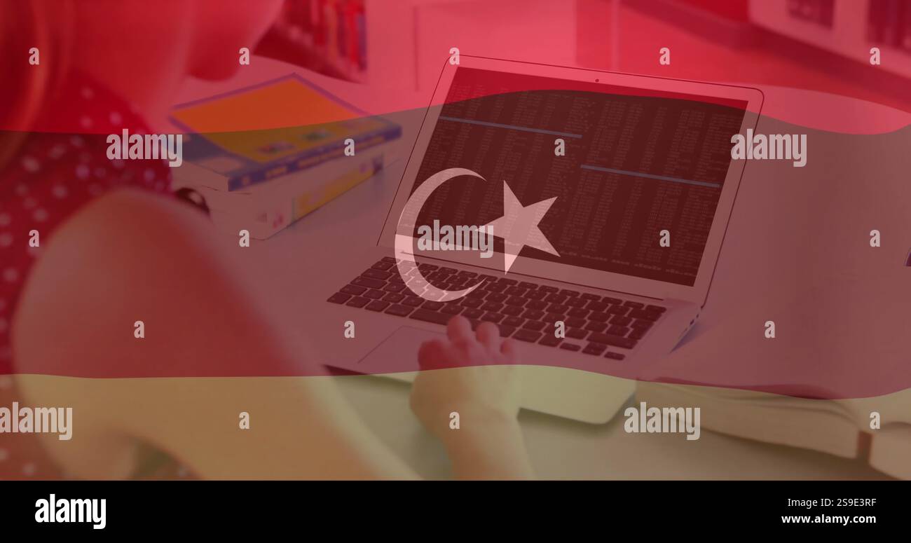 Hands typing on laptop keyboard with Turkish flag image over screen ...