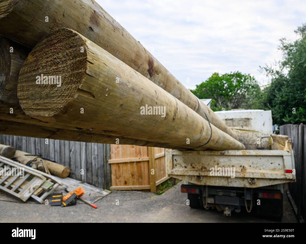 Treated retaining posts on the truck, parked on the narrow driveway ...
